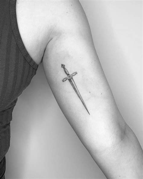 Fine Line Dagger Tattoo On The Inner Arm