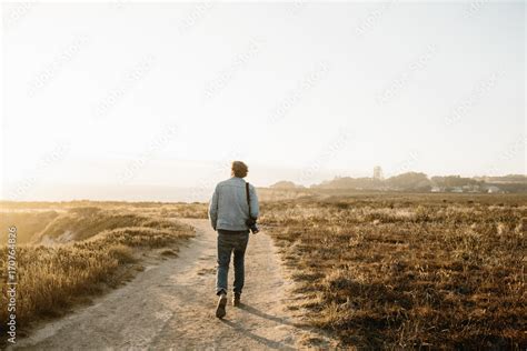 Couple Walking Down A Path
