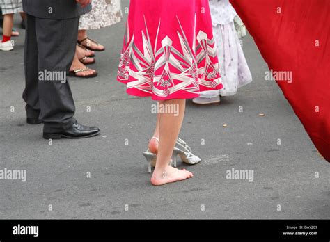 Girl Momentarily Resting Her Feet During Holy Spirit Procession At The