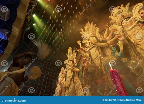 Hindu Priest Worshipping Goddess Durga With Chamor Fly Whisk Fan