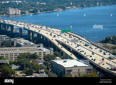 Aerial View Of Freeway Overpass Junction With Fast Moving Traffic Cars And Trucks Interstate