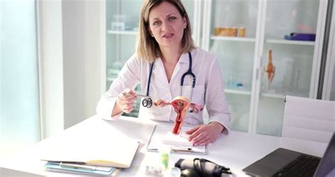 Gynecologist Doctor Points To Model Of Female Reproductive System In