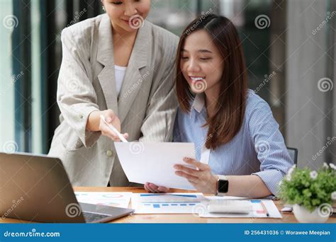 Financial Analyst Discussing With Investment Banker At Meeting Room