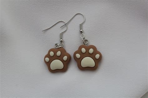 Örhängen Med Bruna Tassavtryck Chill Consulting