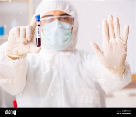 The Young Handsome Lab Assistant Testing Blood Samples In Hospital