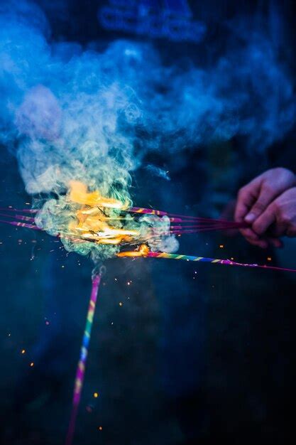 Premium Photo Cropped Hands Burning Sparklers
