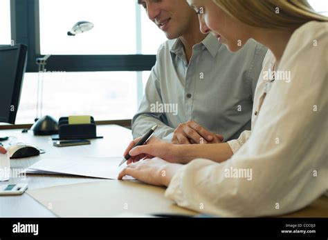Couple Signing Contract Stock Photo Alamy