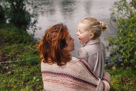 Mother Playing With Her Little Daughter By Stocksy Contributor