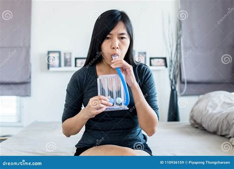 Patient Using Incentive Spirometer Or Three Balls For Stimulate Lung