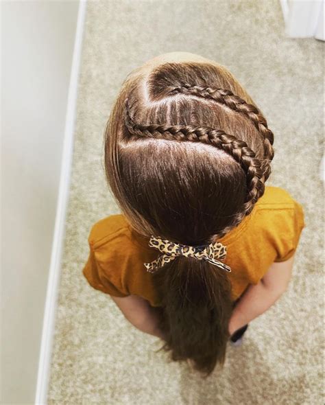 Two Curved Dutch Lace Braids Into A Ponytail Finished With A Cheetah