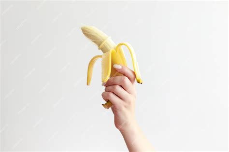 Premium Photo Banana In A Condom On A White Background