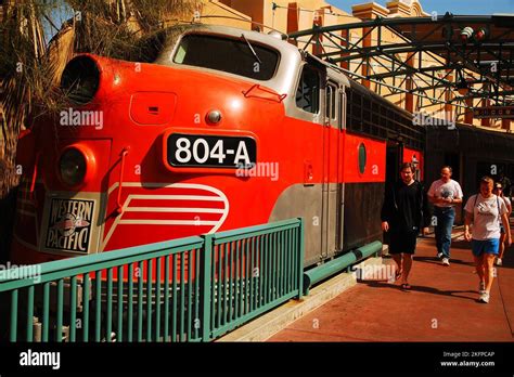 People Walk Past A Historic Western California Zephyr Locomotive Engine