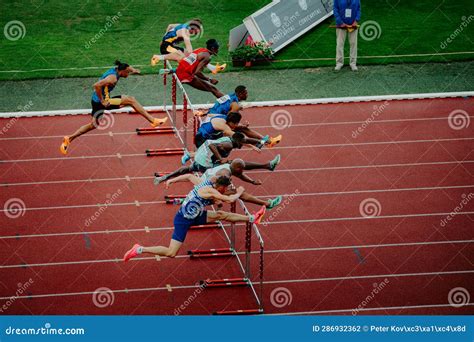 Athletes Compete In 110m Hurdles Race During Track And Field