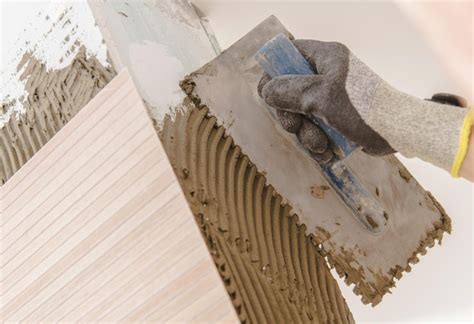 Premium Photo Men Installing Ceramic Tiles