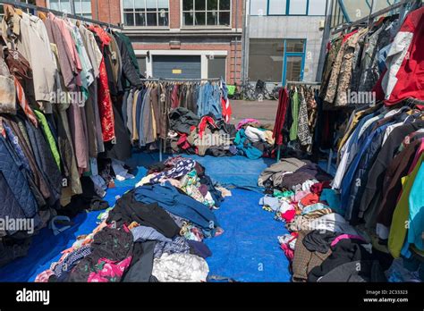 Stall With Second Hand Clothing Garment At Flea Market Stock Photo Alamy