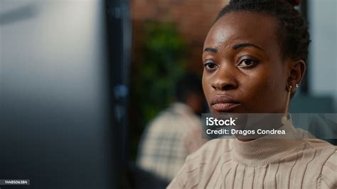 African American Software Programer Working Focused Looking At Computer Screen And Smiling While