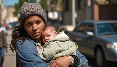 Premium Ai Image Homeless Mother Holding Baby In Her Hand