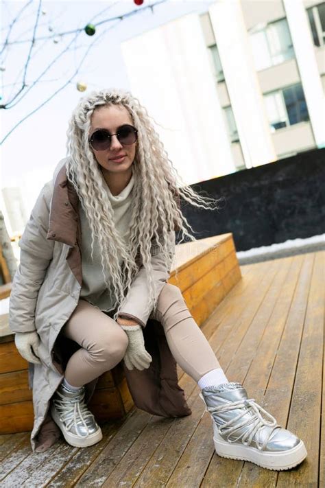Woman Sitting On Wooden Bench Wearing Sneakers Stock Image Image Of