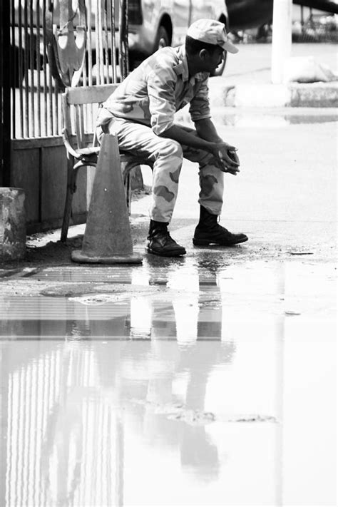 Nag Iisip Si Mamang Pulis Photograph By Jez C Self Fine Art America