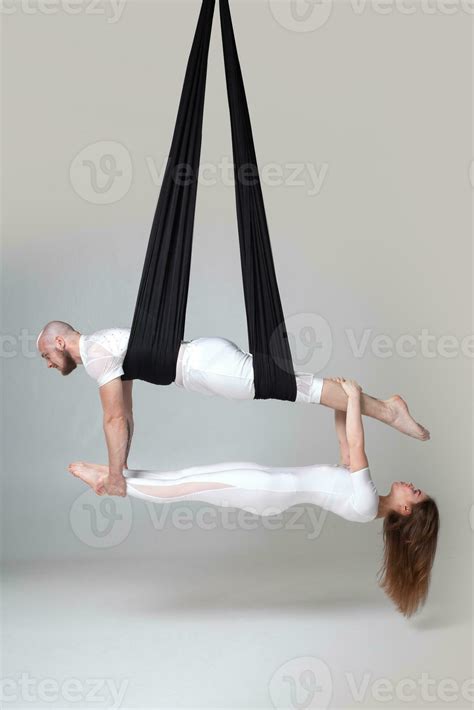 Beautiful Girl And An Athletic Man In A White Sport Suits Are