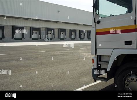 The Loading Area Of A Industrial Warehouse With Several Loading Bays