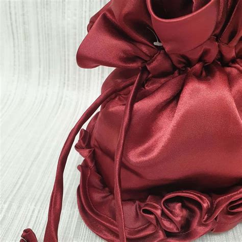 super cute burgundy draw string handled sateen dolly bag with gorgeous