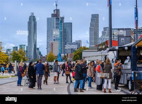 People Queuing To Buy Refreshments From Street Food Truck Outside Of