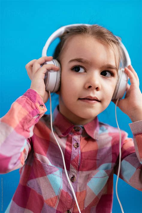 Cute Girl With Headphones By Stocksy Contributor Mihajlo Ckovric