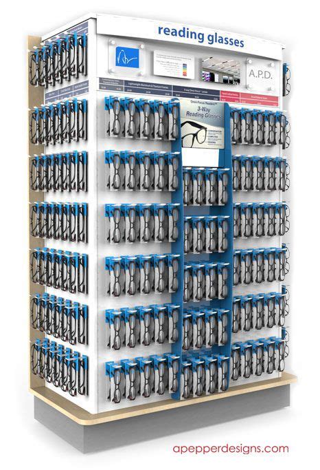 The Reading Glasses Are Stacked On Top Of Each Other In Front Of A