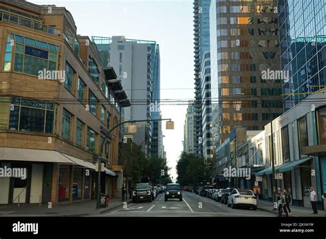 A View Of A Busy Street In Downtown Vancouver With People Walking On