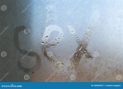 Sex Inscription On The Sweaty Glass With Drops Dripping Condensate