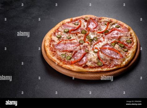 Delicious Fresh Crispy Pizza From The Oven With Ham And Bulgarian