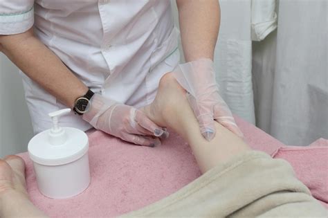 Premium Photo Relaxing Massage On The Foot In Spa Salon Indoors