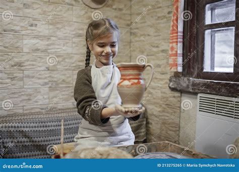 Girl Playing With Modeling Clay On Pottery Wheel At Workshop Craft Art Artisan Hobby And