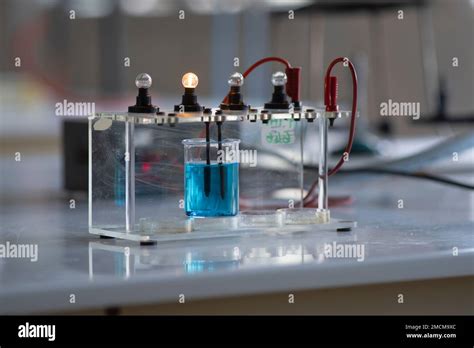 Electrolyte Solution Turns On A Light Bulb Experiment In The Chemistry
