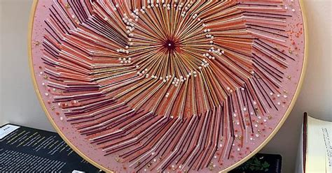 Radiate 12 Inch Hoop W Orange Purple White And Gold Threads French Knots And Bead