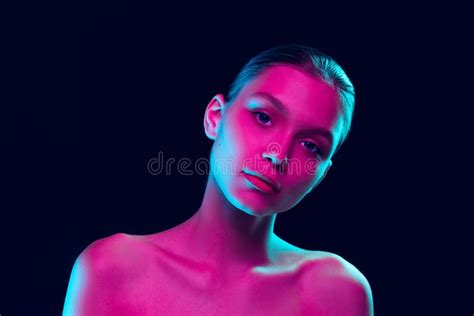 Portrait Of Tender Young Woman Posing Isolated Over Dark Background In
