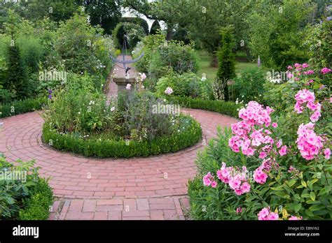 Fall Phlox Garden Phlox Phlox Paniculata Garden With Sundial Germany Lower Saxony Stock