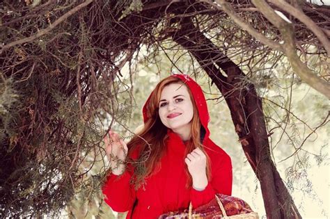 Premium Photo Portrait Of Woman Standing By Tree In Forest Red Riding