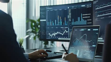 Computer Monitors Close Up Of A Male Financial Data Analyst Using A