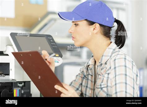 Woman Printer Checking Its State Stock Photo Alamy