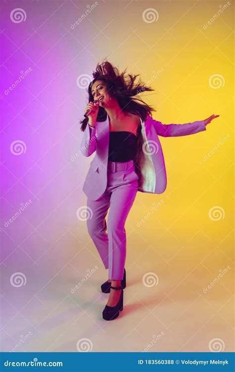 Caucasian Female Singer Portrait Isolated On Gradient Studio Background