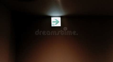 Emergency Exit Sign At The Top End Of The Dark Room Stock Image Image Of Dark Room