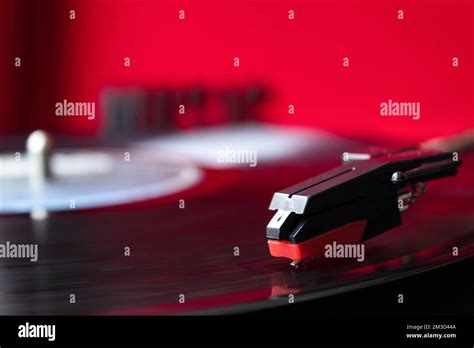 Close Up To A Turn Table Needle Playing A Lp Vinyl Disc With Turn Table
