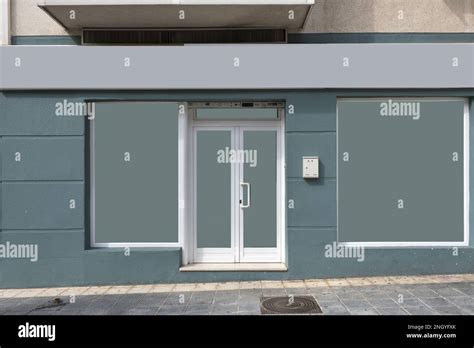 Front Facades Of Premises At Street Level With Opaque Windows And