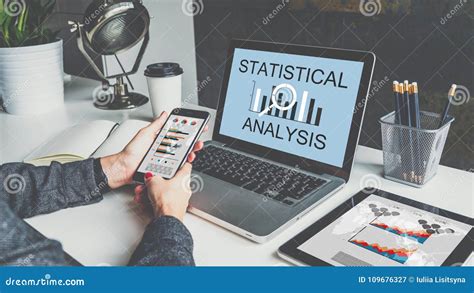On Table Are Laptop With Inscription Statistical Analysis On Screen Digital Tablet With Charts