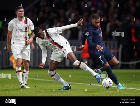 Psgs Kylian Mbappe In Action Against Ac Milans Fikayo Tomori During
