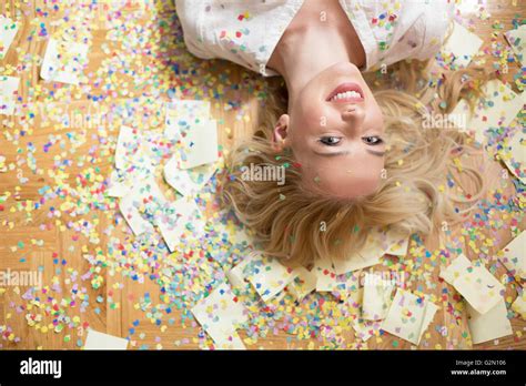 Cheerful Young Woman Is Stretching Out Her Hands While Confetti Falling