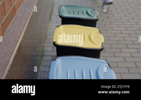 Close View Of The Sorting Bin And The Male Hands In Gloves Puts Plastic Bottle Inside The