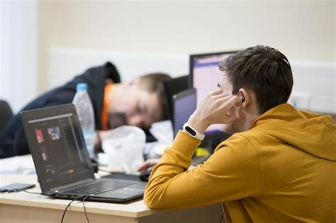 Premium Photo Tired Programmers Students At The Computer